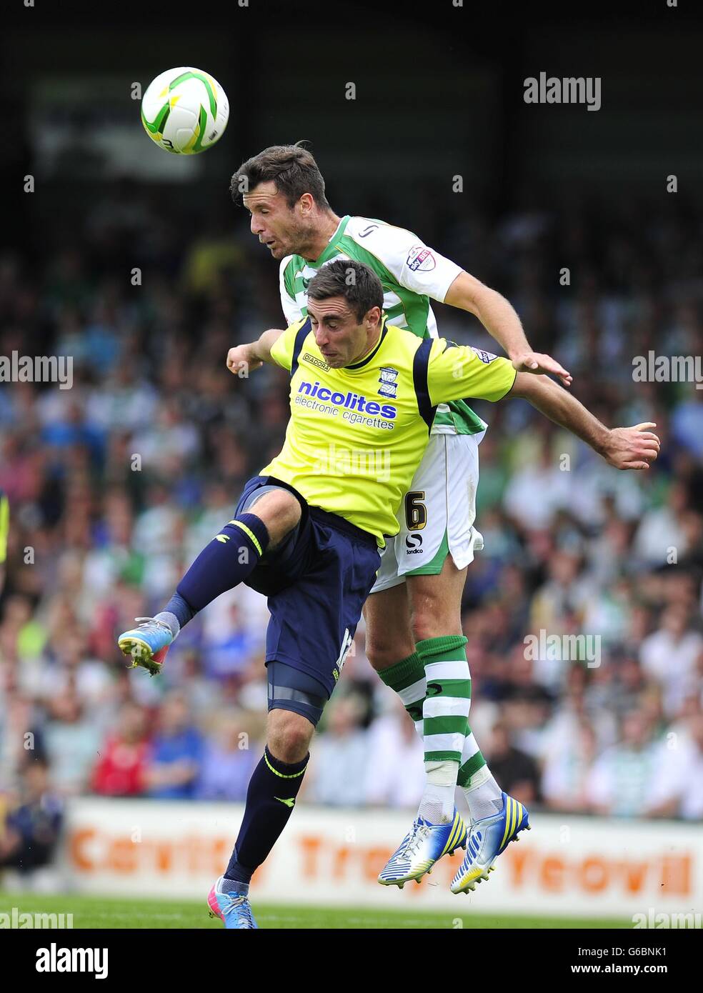 Yeovil Town's Daniel Seaborne (right) and Birmingham City's Lee Novak ...