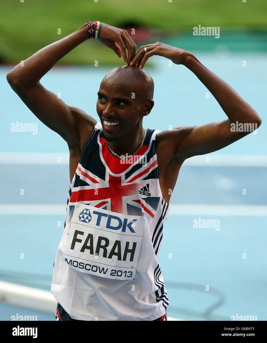 Great Britain's Mo Farah celebrates by doing the 'MoBot' after winning ...