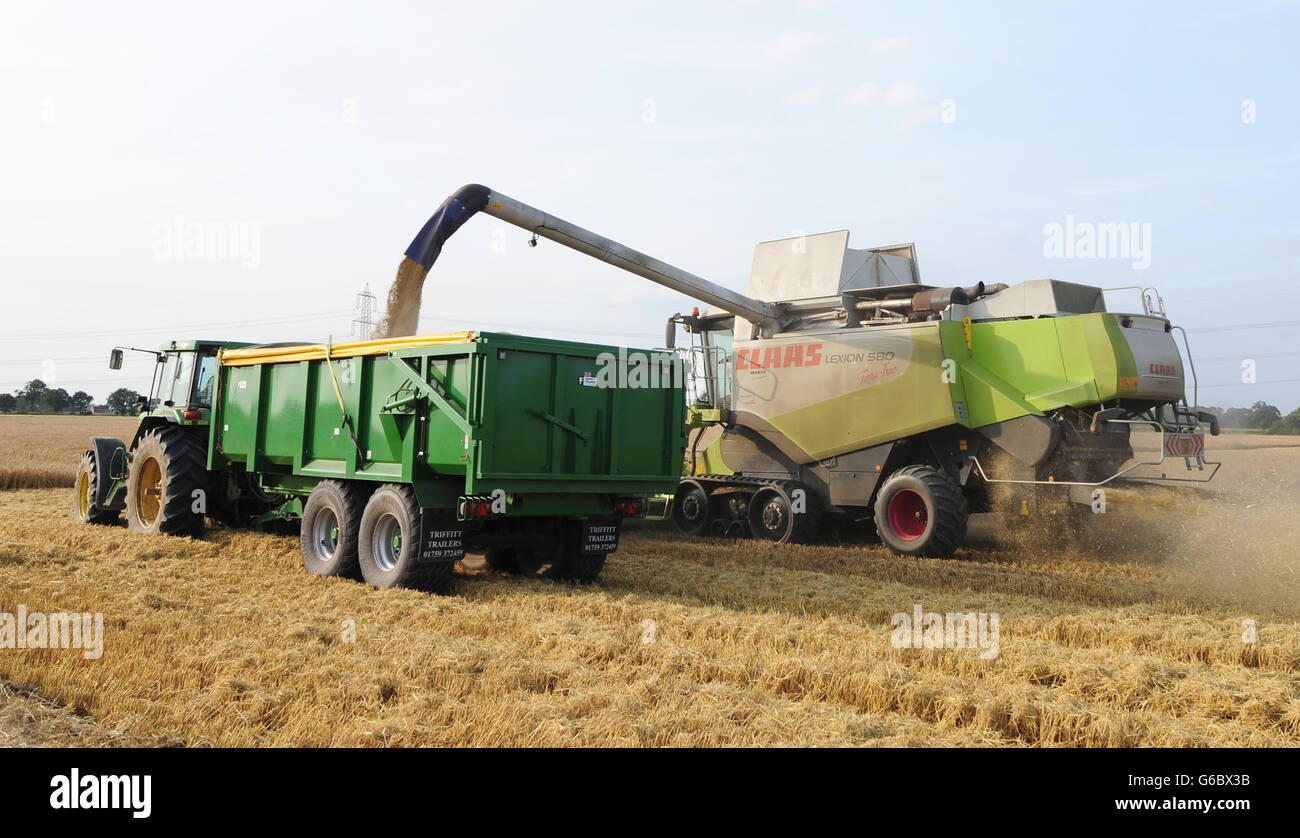 A combine harvester at work in a field outside York Stock Photo - Alamy