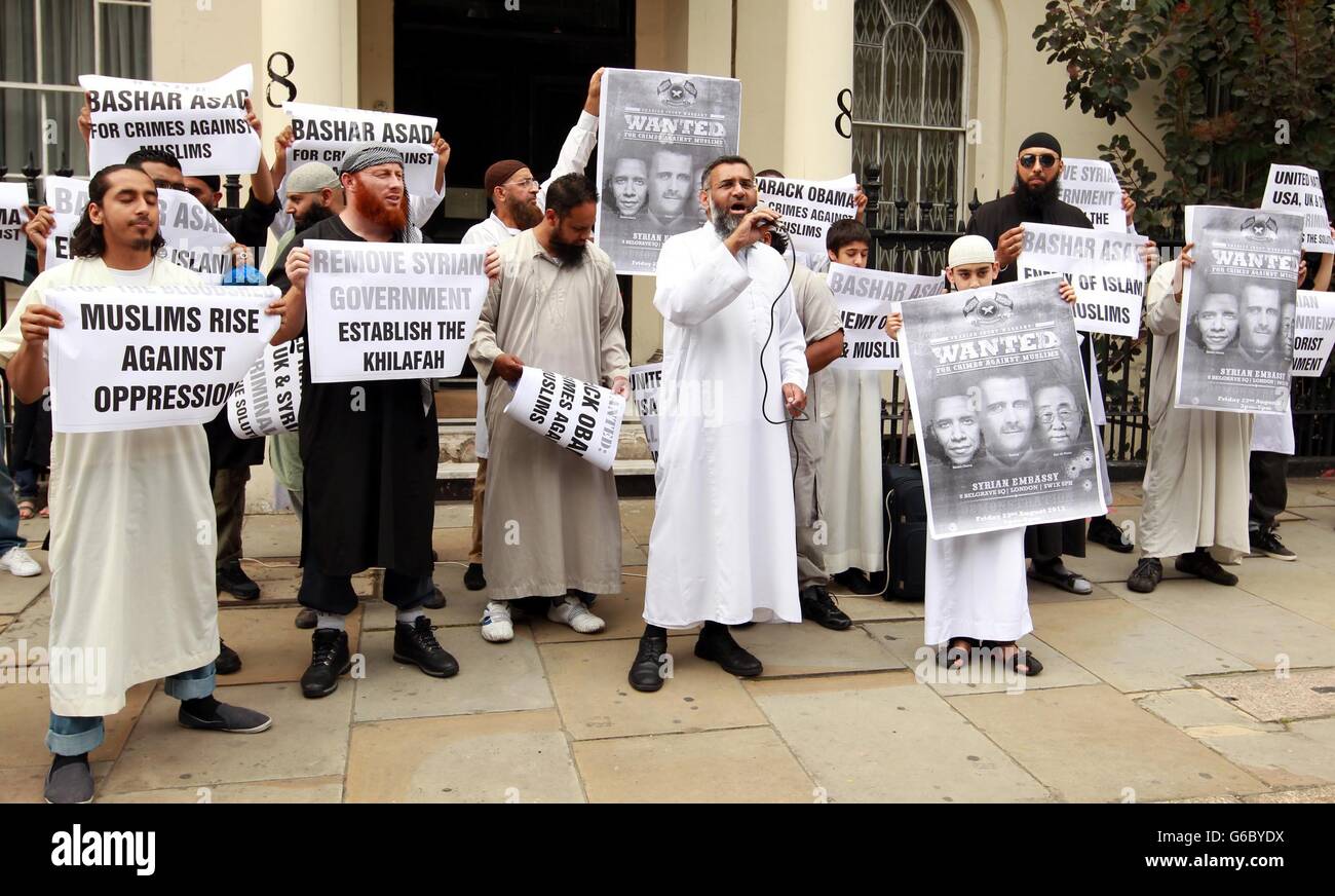 Anjem Choudary (centre) with fellow demonstrators outside the Syrian ...