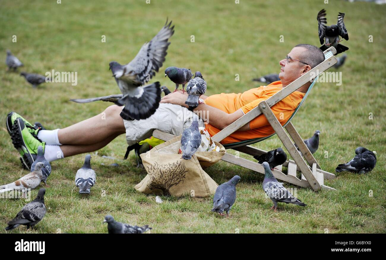 A man makes the most of the hot weather hi-res stock photography and ...