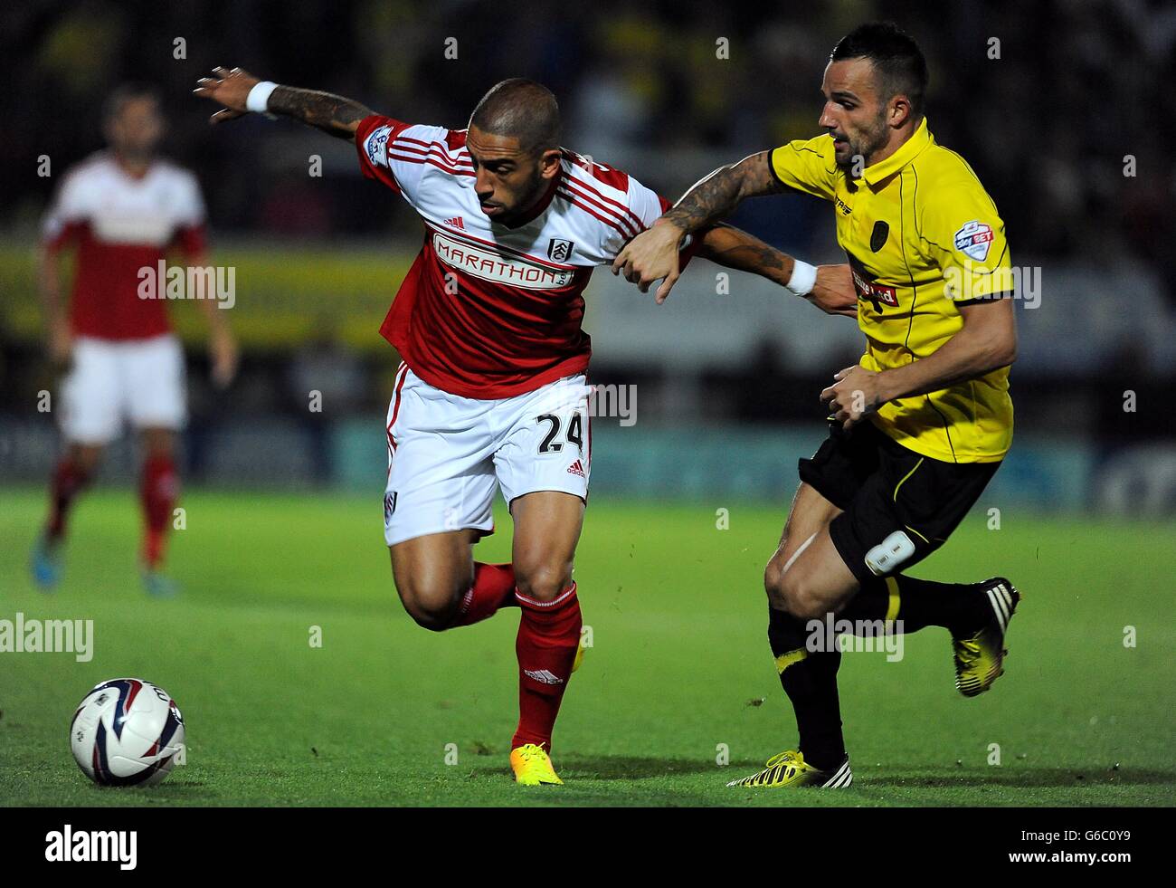 Fulham's Ashkan Dejagah (left) and Burton Albion's Robbie Weir battle ...