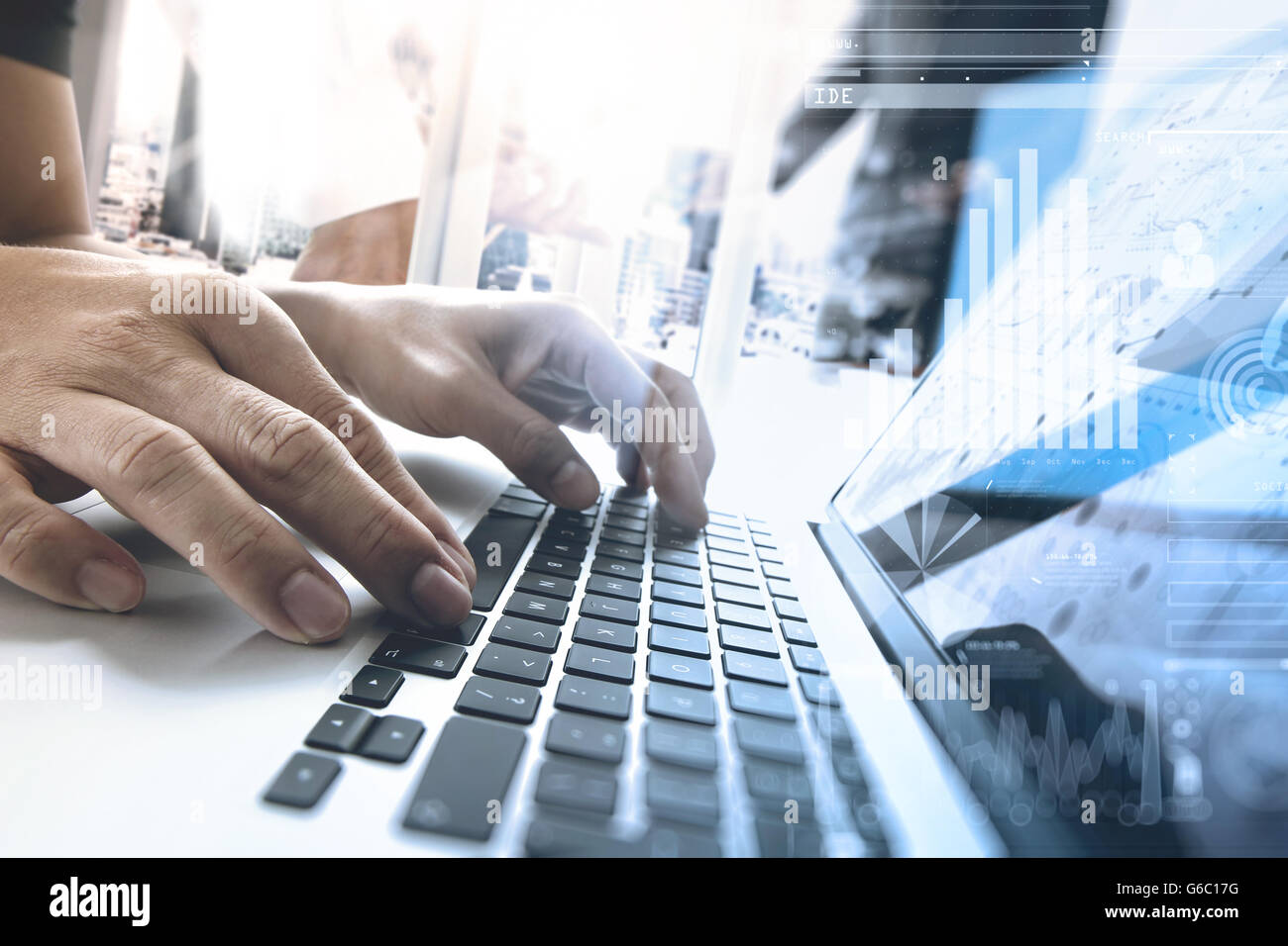 business documents on office table with smart phone and laptop computer ...