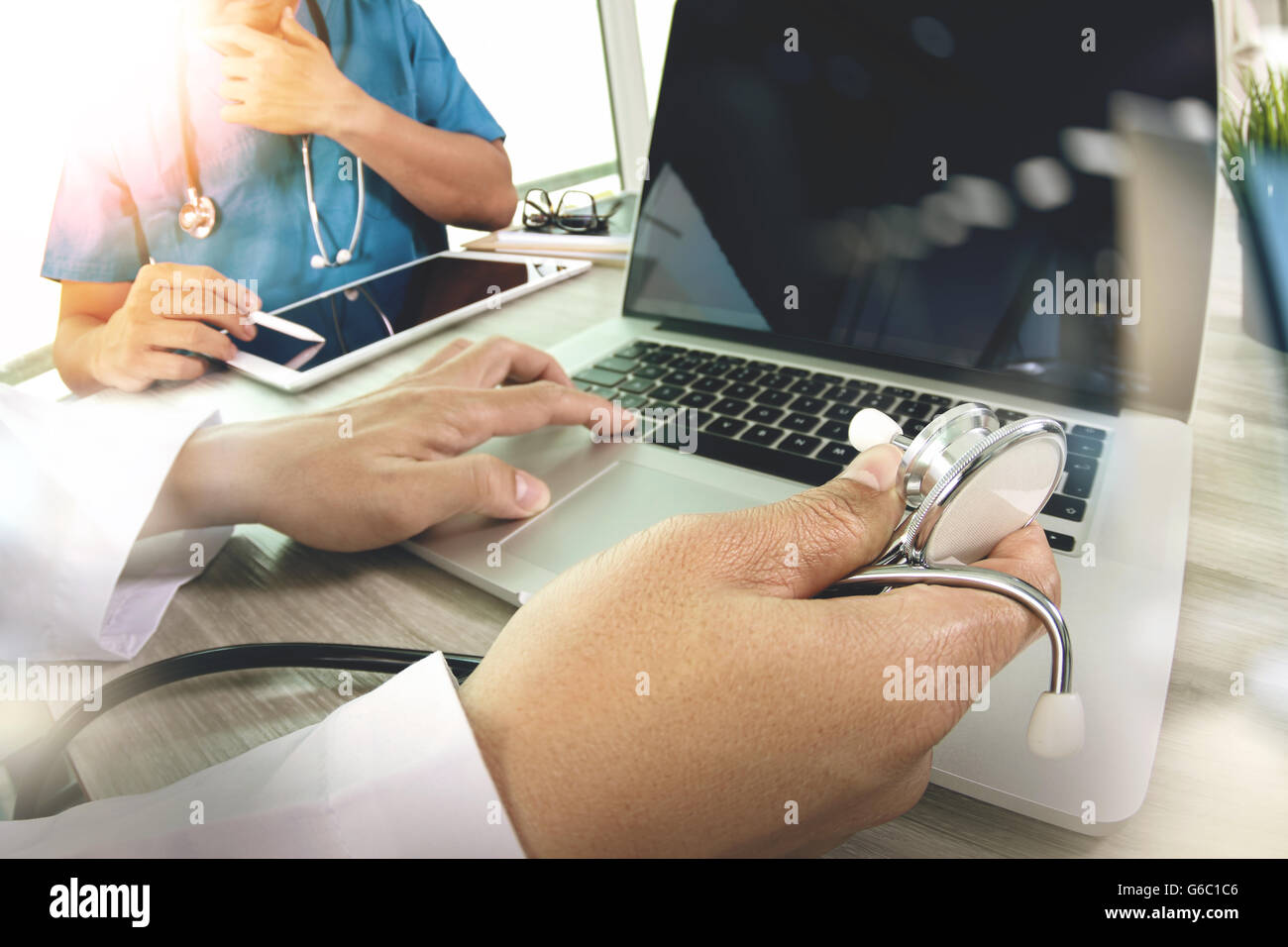 Medicine doctor hand working with modern computer and digital pro ...