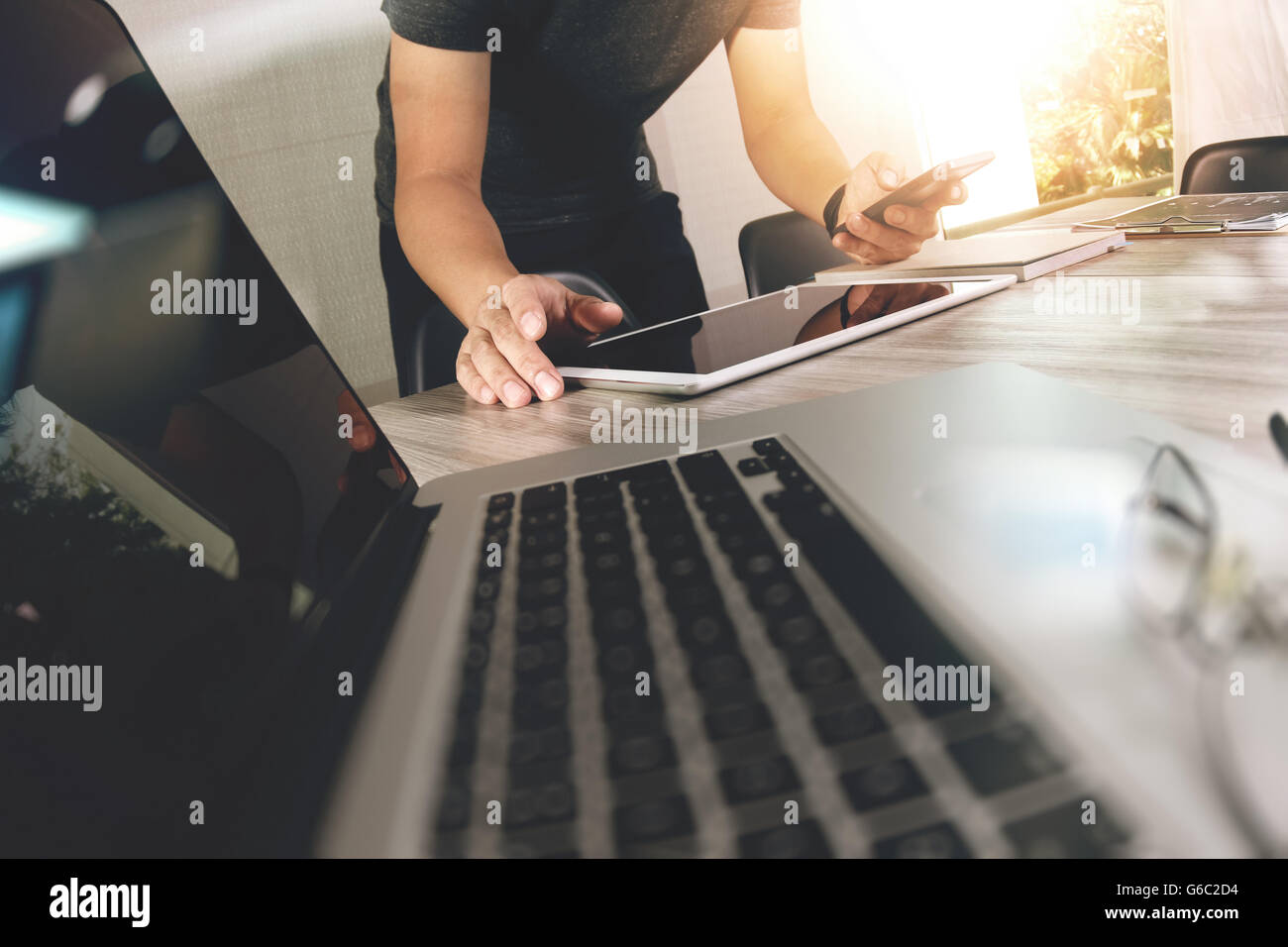 Website designer working digital tablet and computer laptop with smart ...