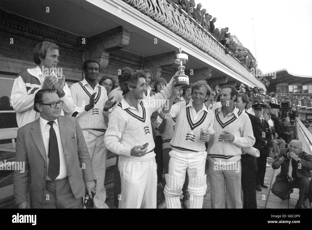 Middlesex captain Mike Brearley (left) and Clive Radley hold aloft the ...