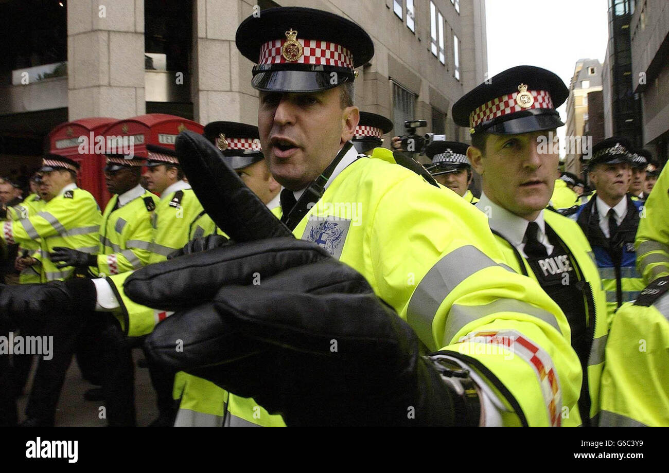 Police hold protestors back in London's Trafalgar Square, during the ...