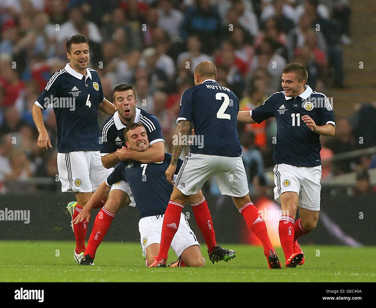 Scotland's James Morrison (7) celebrates with team-mates after scoring ...