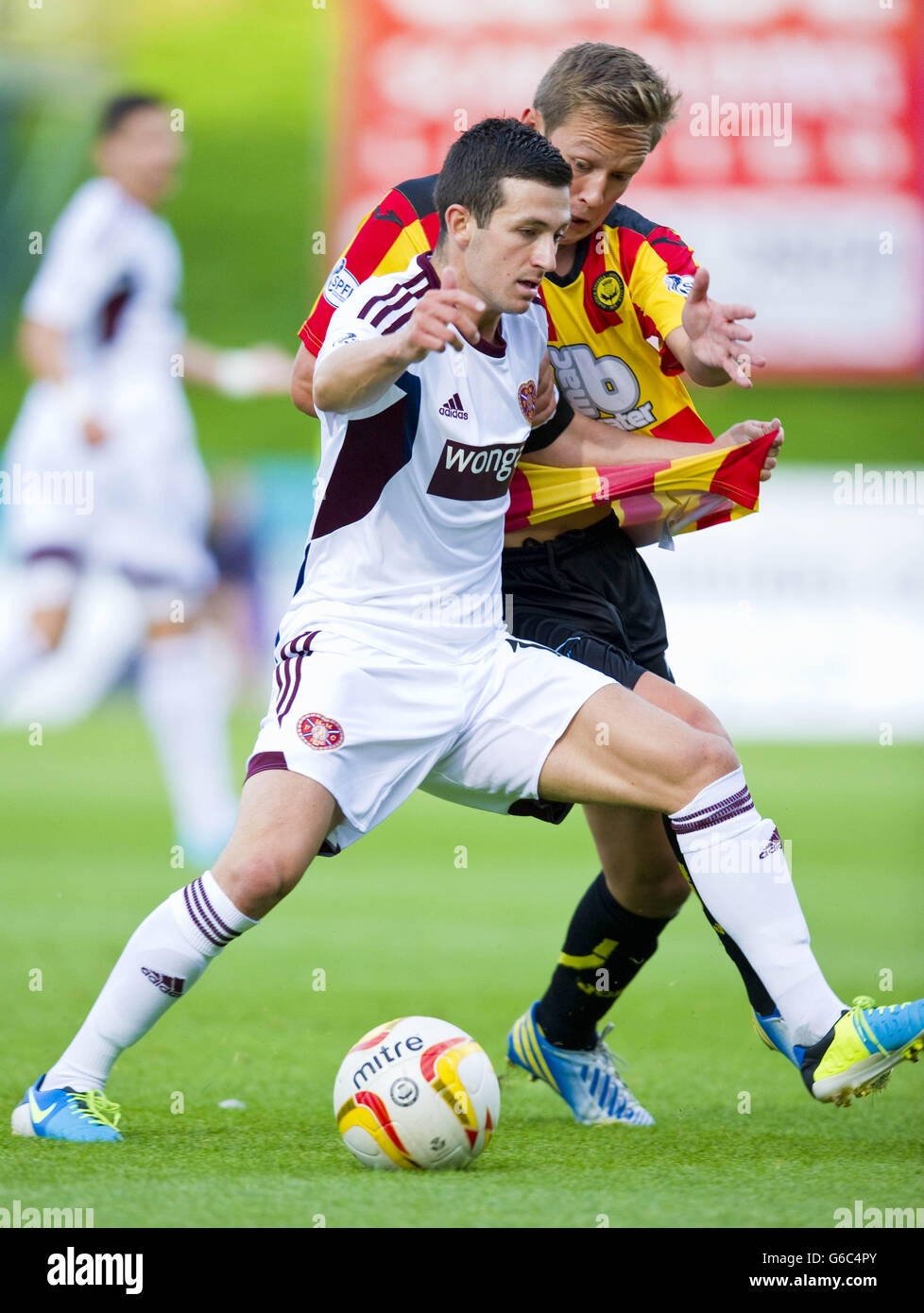Heart's Jason Holt gets hold of Partick Thistle's James Craigen during ...