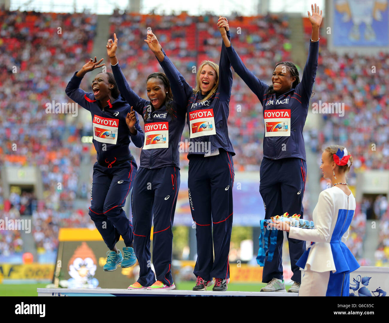 The French 4x100 women's relay team celebrate on the podium before ...