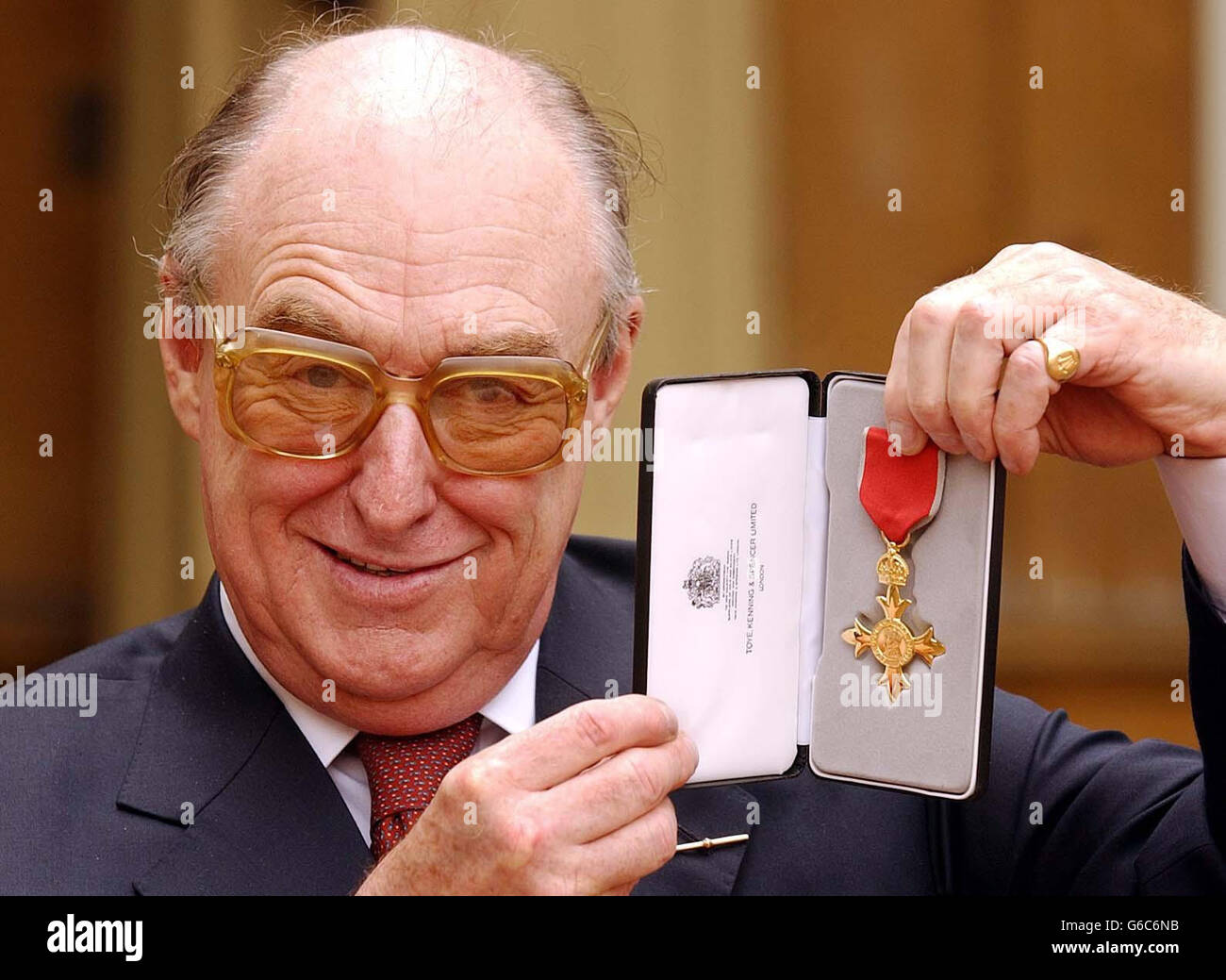Henry Blofeld the cricket commentator proudly holds his OBE which was ...