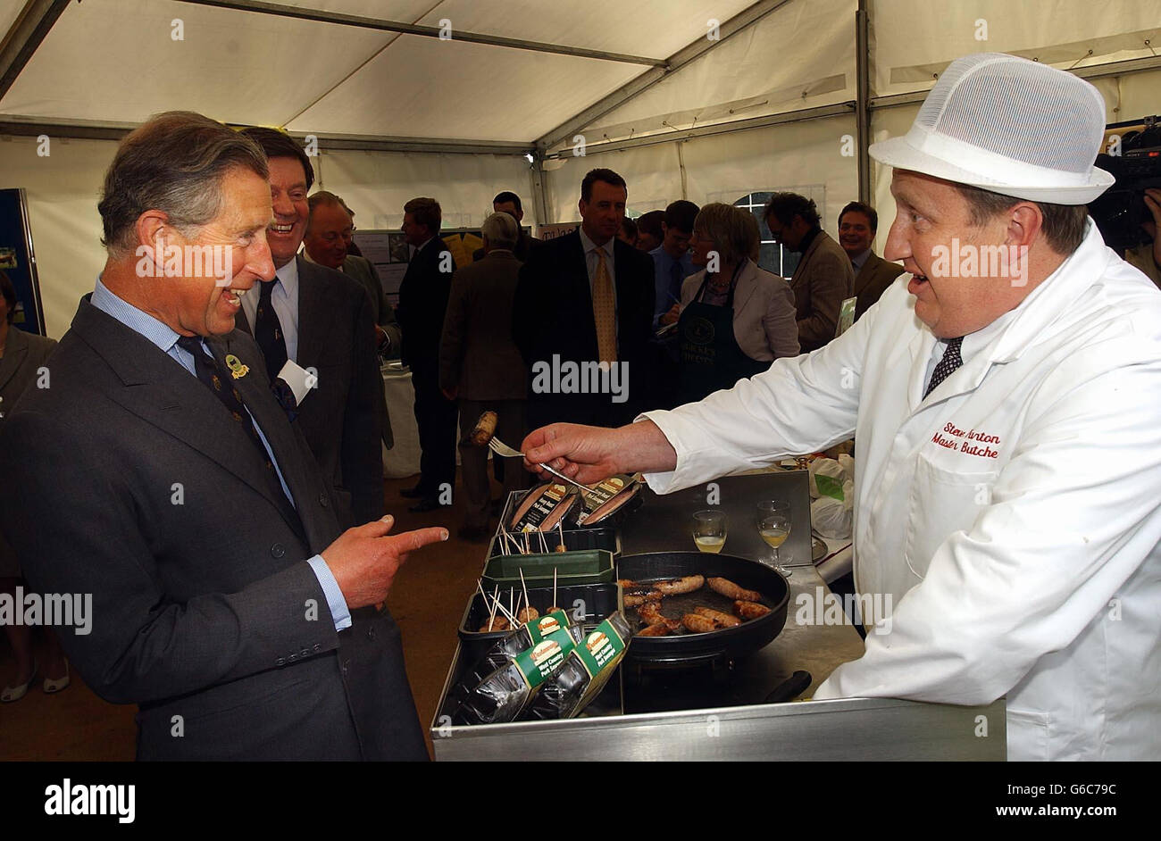 The Prince of Wales is offerd a Westaways sausage from Steve Turton as ...