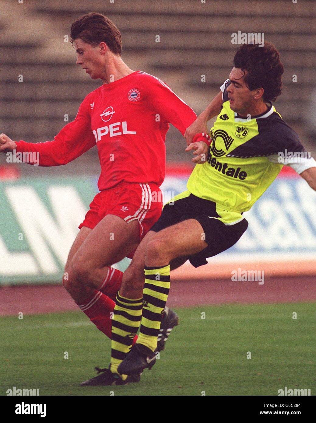 l-r; BRIAN LAUDRUP [BAY], GERHARD POSCHNER [BORR]. BAYERN MUNICH v ...