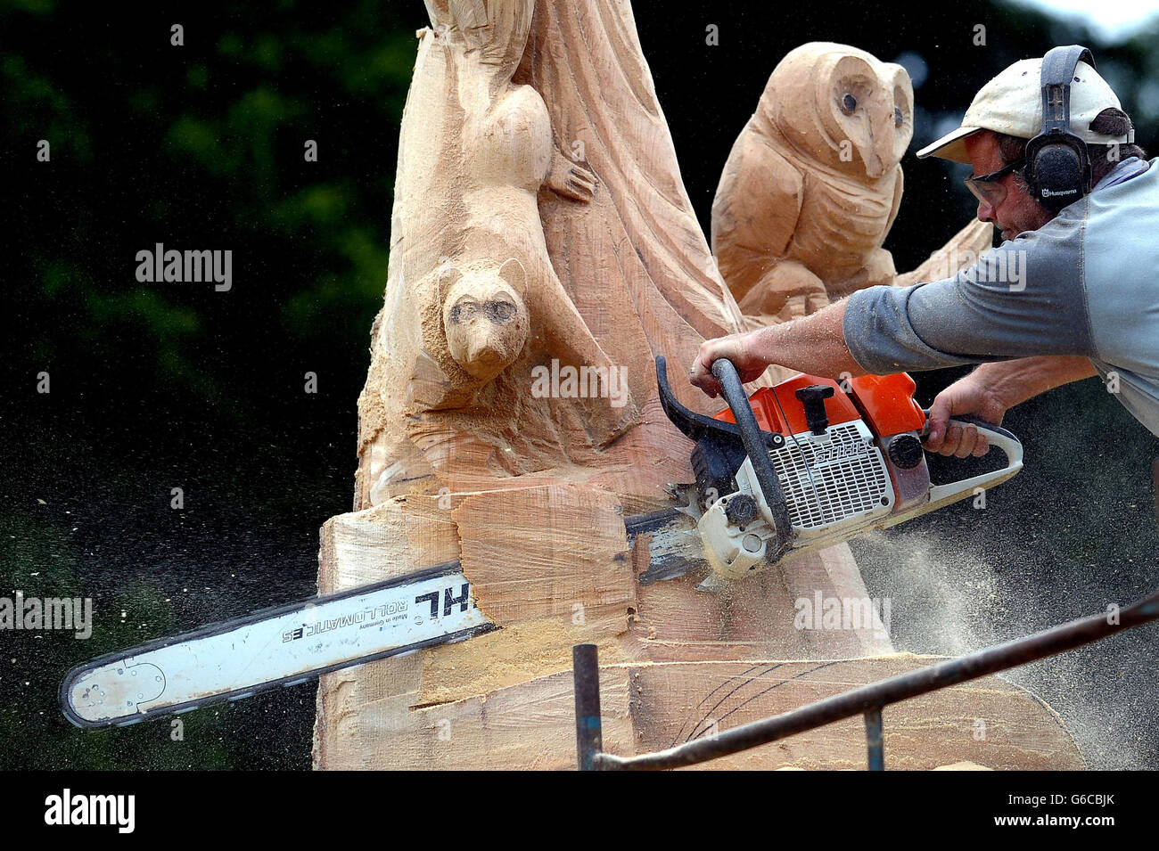 Carver Raymond Wirick works on his Little Bo Peep storytelling chair ...