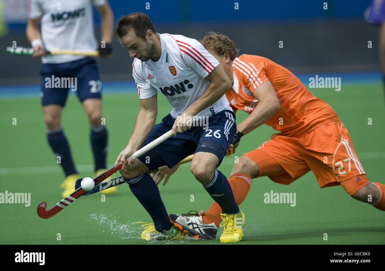 England's Nick Catlin (left) challenges with Netherland's Constantijn ...