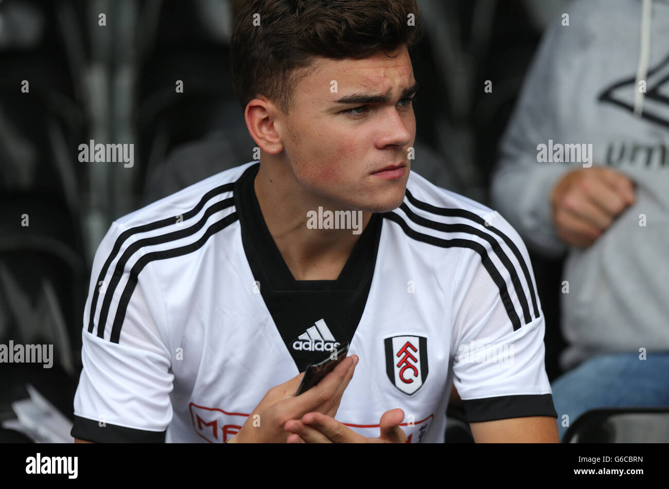 A Fulham fan wearing the new adidas home kit in the stands Stock Photo ...