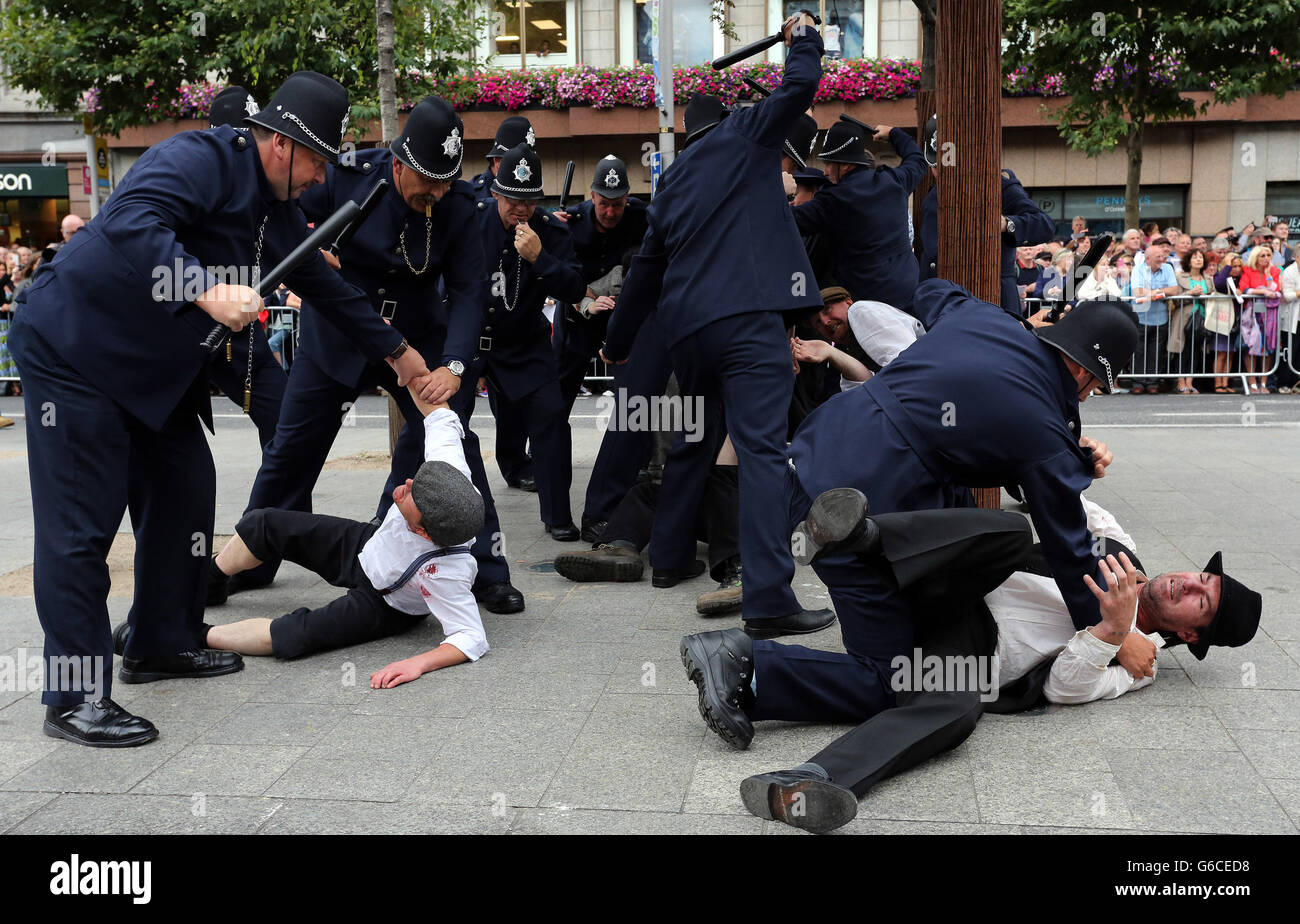People dressed in period costumes, re-enact the 100th anniversary of a ...