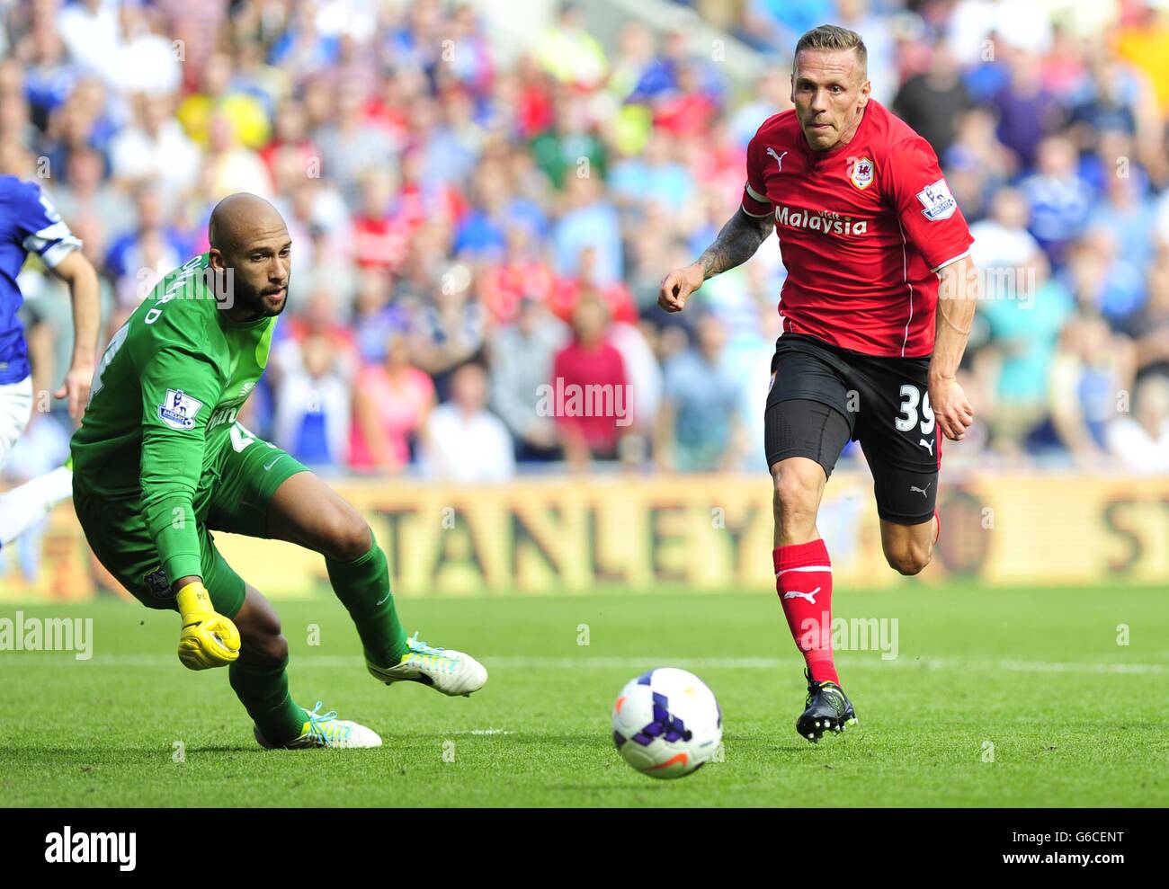 Cardiff City's Craig Bellamy and Everton goalkeeper Tim Howard in ...