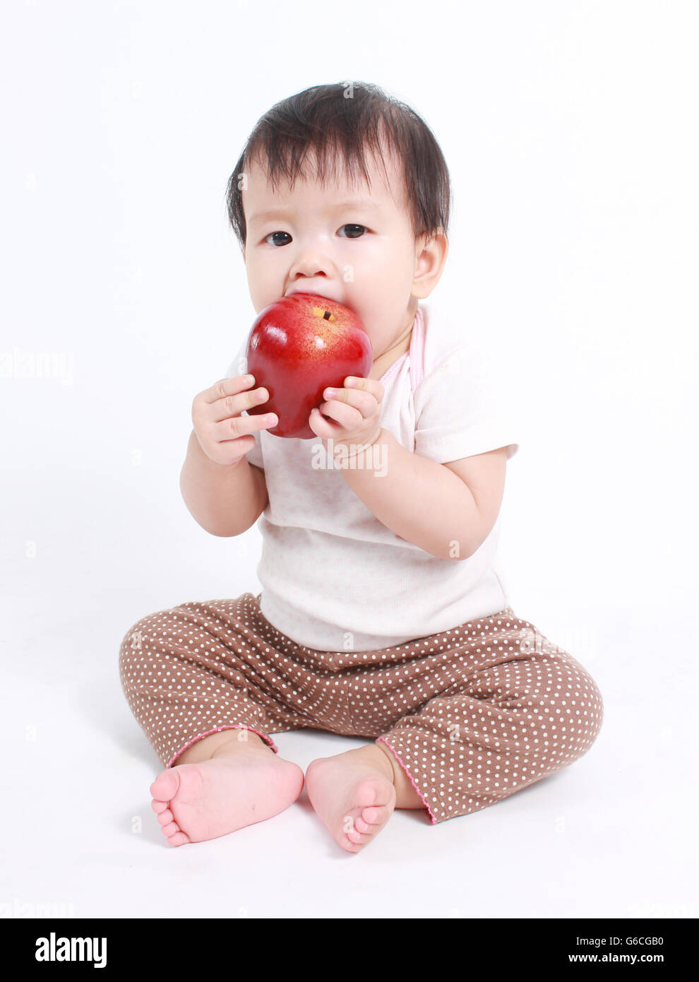 Cute baby with red apple (eating healthy food Stock Photo - Alamy