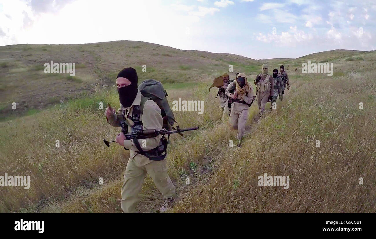 Islamic State fighters with the Storming Battalion on the march to ...