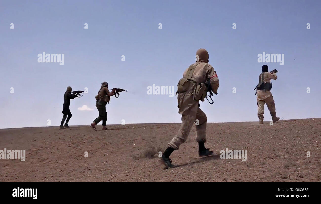 Islamic State fighters fire Ak-47 rifles during fighting in the Makhoul ...