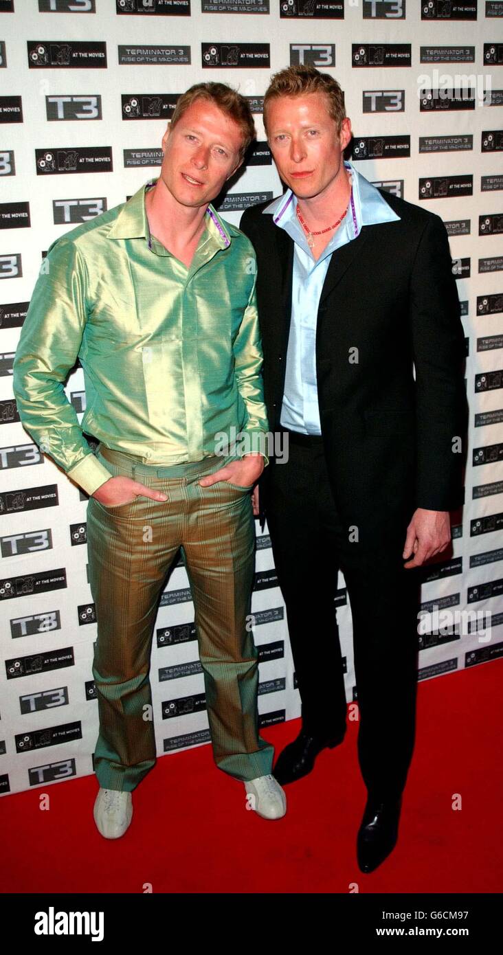 Twin actors Neil (left) and Adrien Rayment pose for photographers as ...