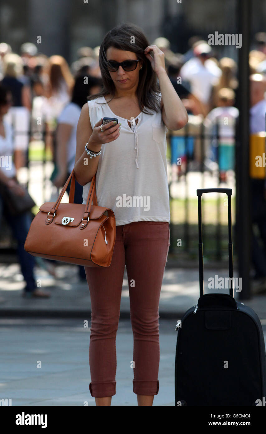 Mobile phones stock. A member of the public uses their mobile phone in ...