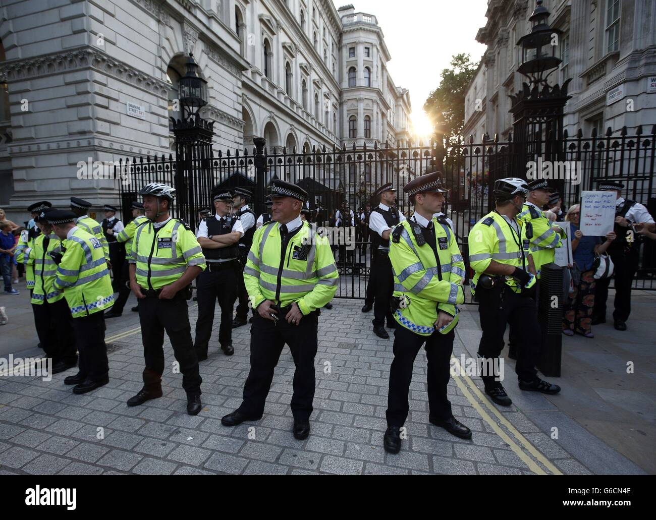 Police stand guard outside Downing Street during an event organised by ...