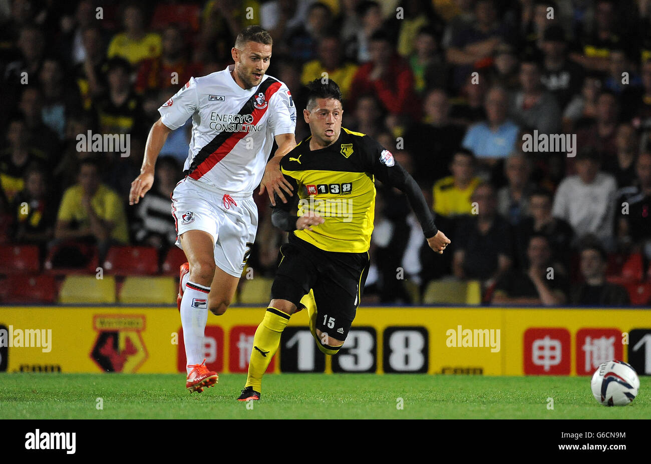 Watford's Javier Acuna (right) and Bournemouth's Simon Francis (left ...