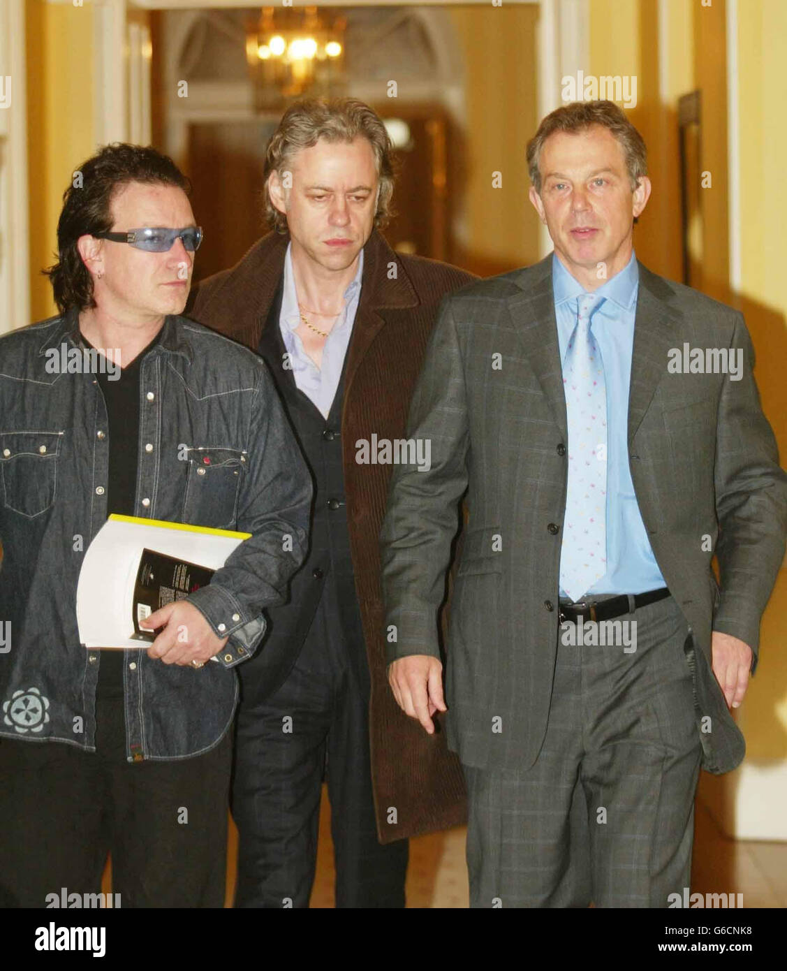 Prime Minister Tony Blair, with Sir Bob Geldof (C) and U2 frontman Bono ...