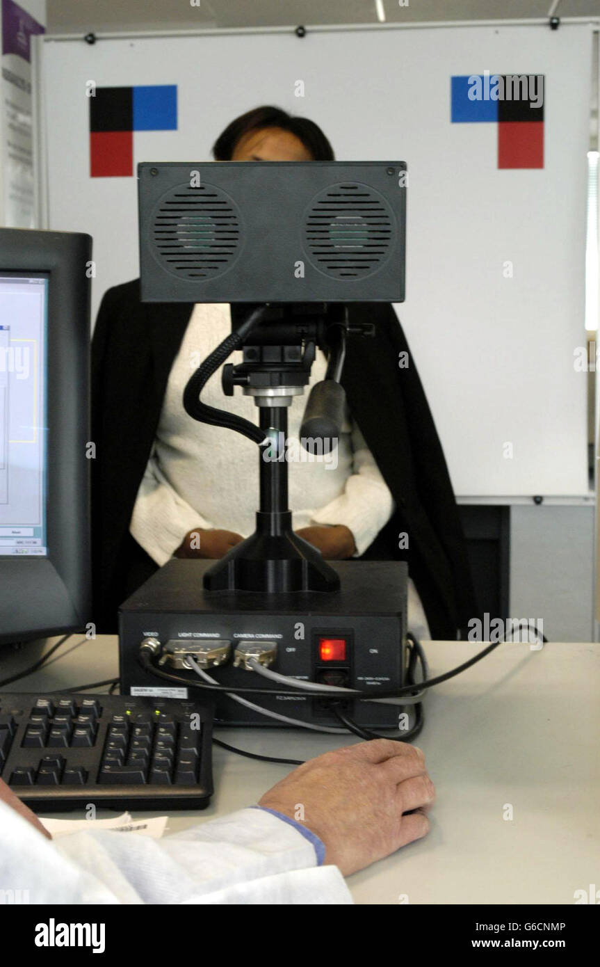 Administrative assistant, takes a photograph of an applicant for the ...