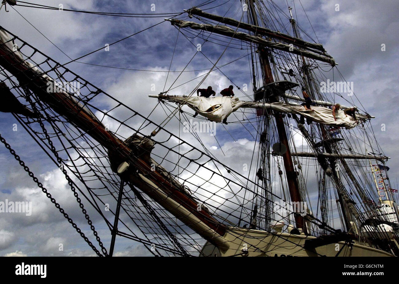 The crew of the tall ship Astrid tie up the sails in front of the Royal ...