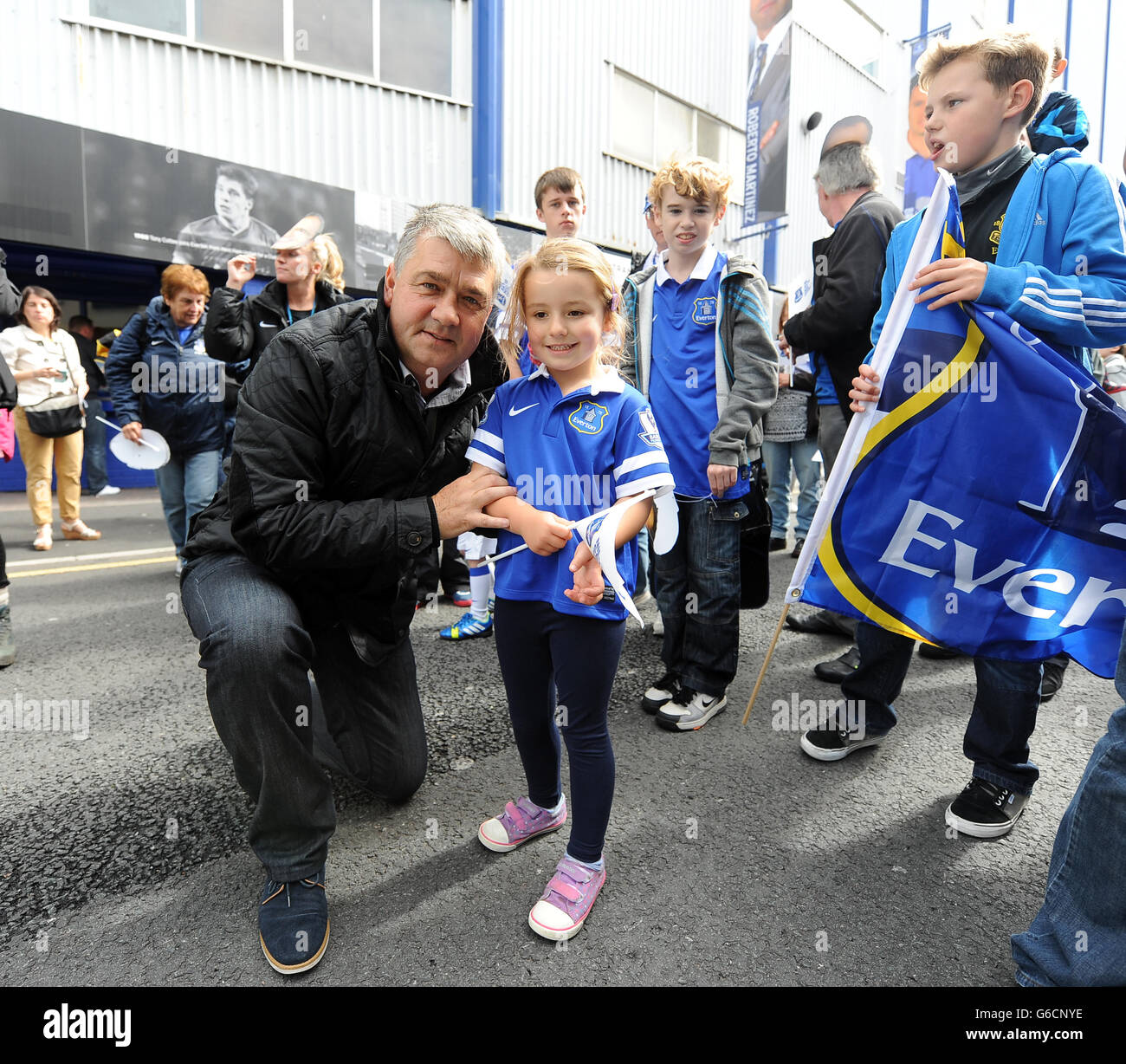 Former Everton player, Ian Snodin (left) greets fans after their march ...