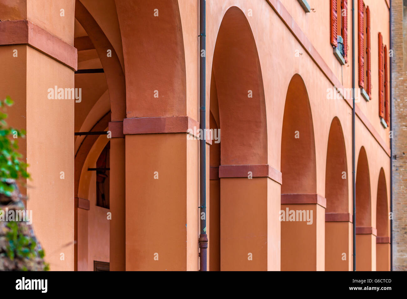 colonnade with arches in old red brick building Stock Photo - Alamy