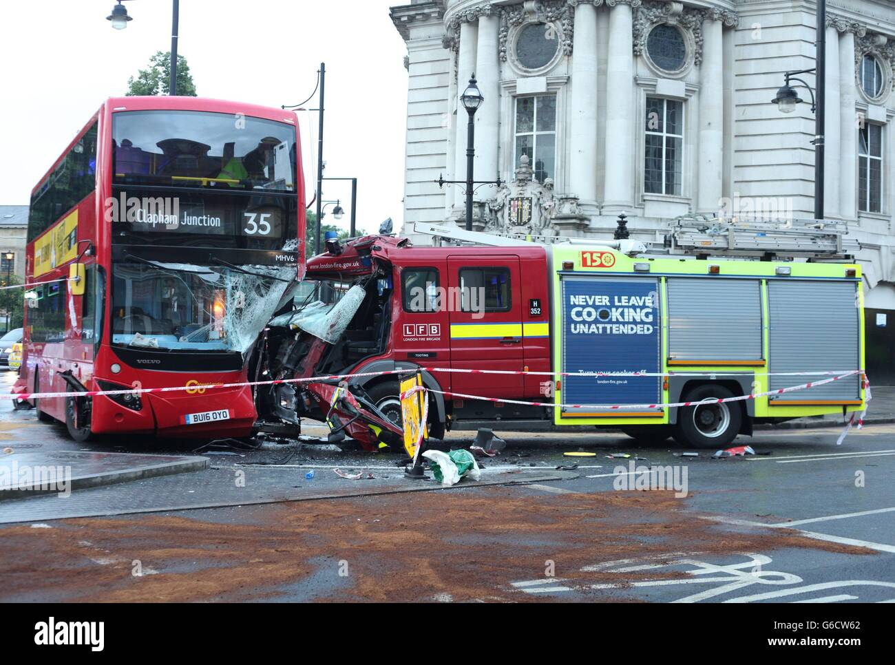 A view of the scene following a collision involving a bus, fire engine ...