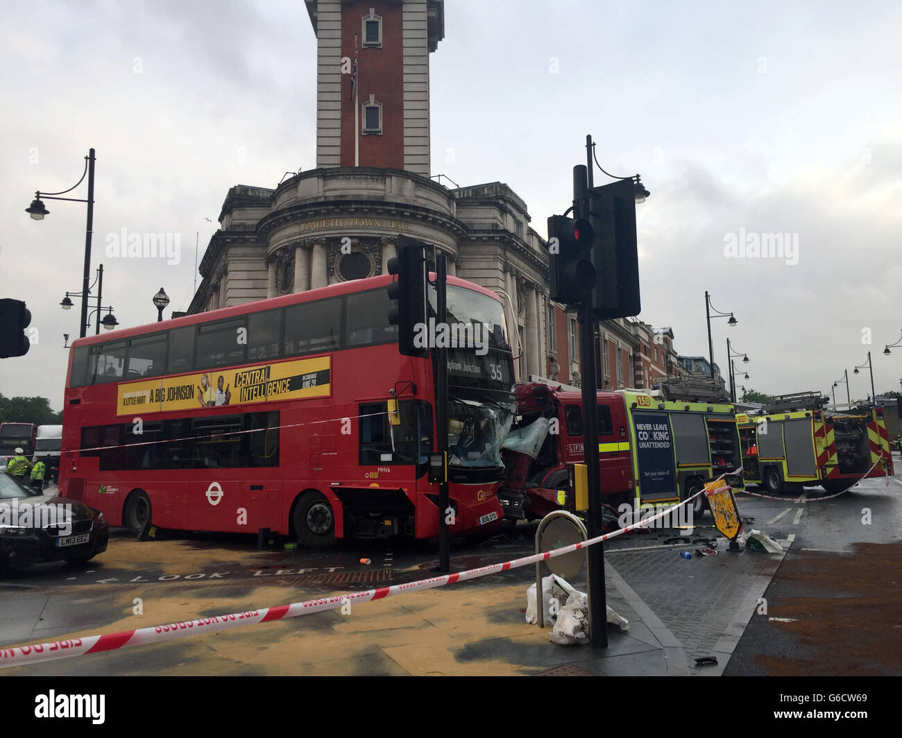 A view of the scene following a collision involving a bus, fire engine ...