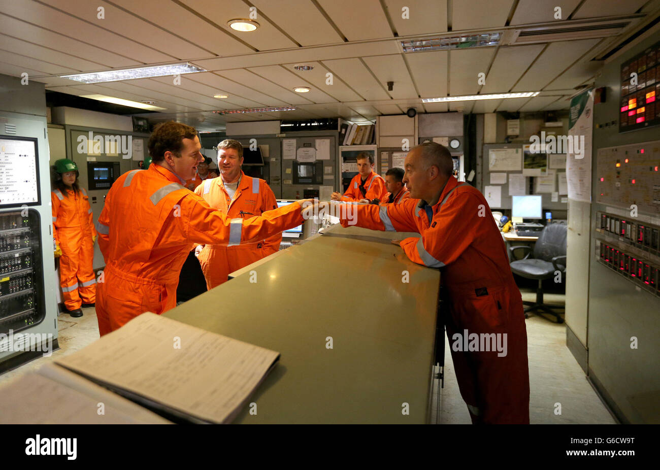 Chancellor George Osborne meets workers in the control room during a ...
