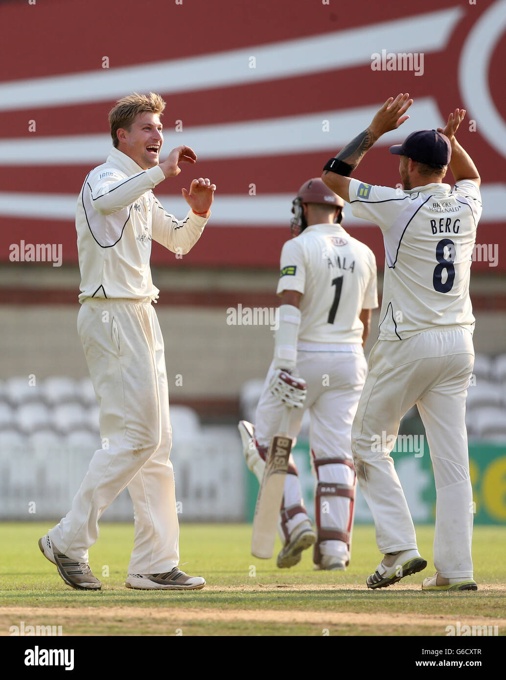 Middlesex's Ollie Rayner (left) celebrates with teammate Gareth Berg ...