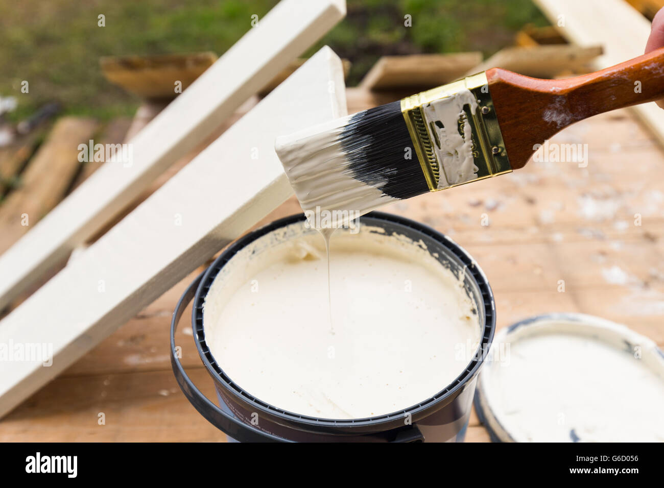 Painting timber boards outside with white paint or white coloured ...