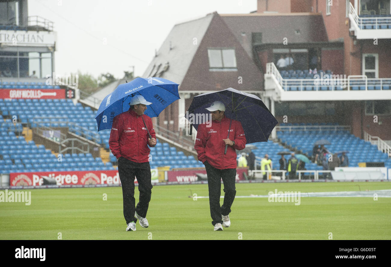Umpires Richard Illingworth and Aleem Dar inspect the outfield during ...