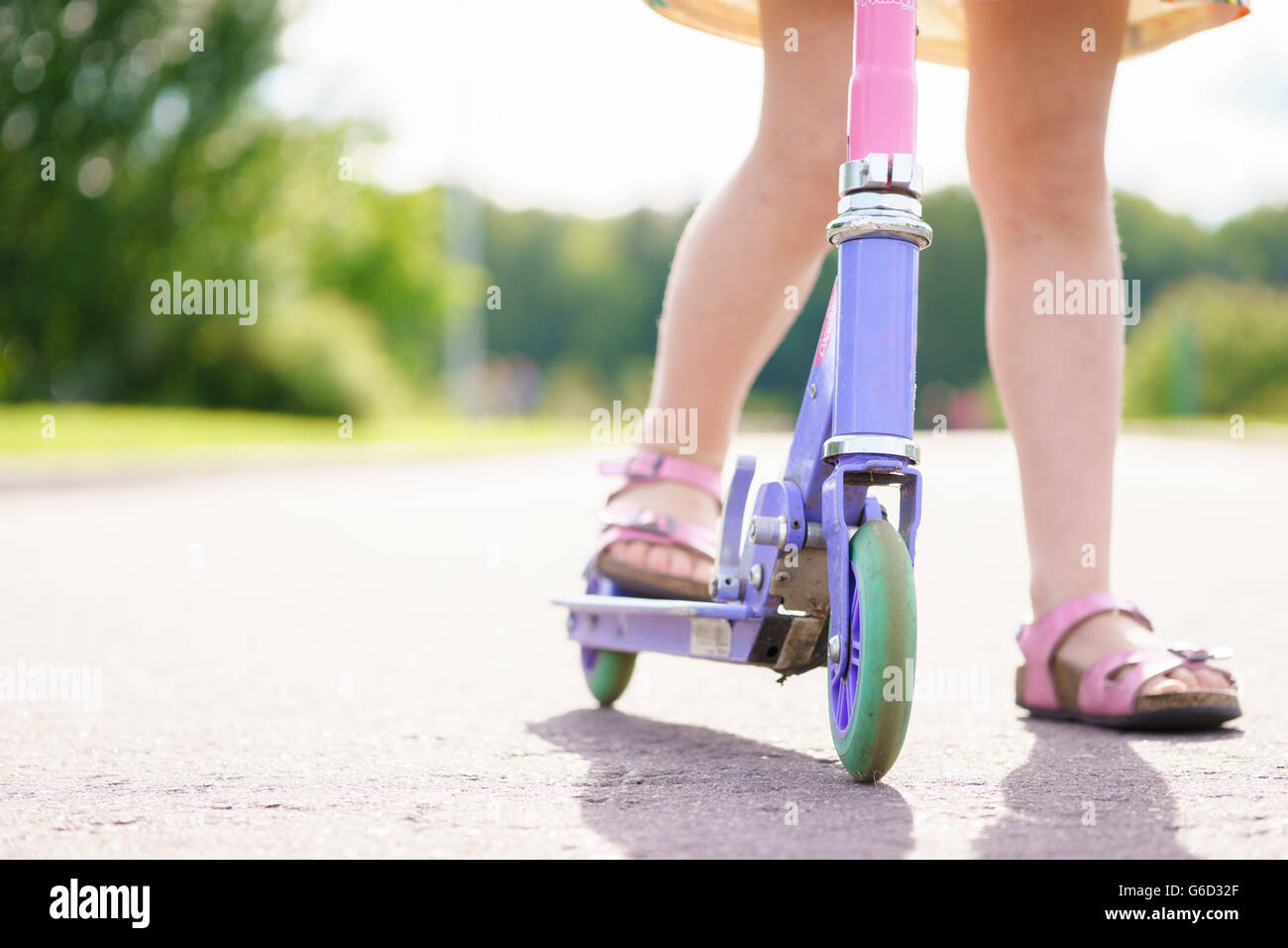Closeup view with legs on scooter Stock Photo - Alamy