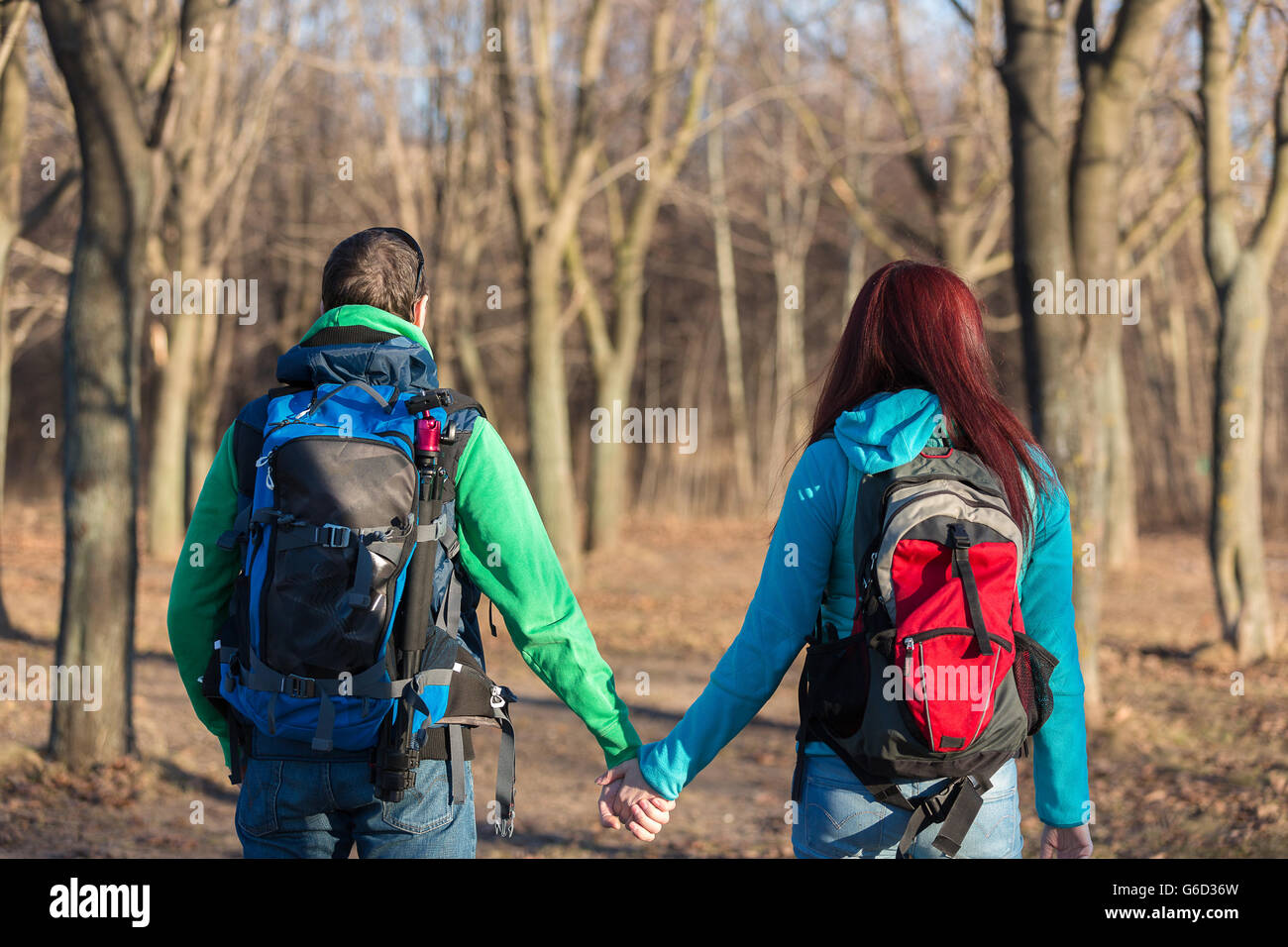 Rear view couple backpacks walking hi-res stock photography and images ...