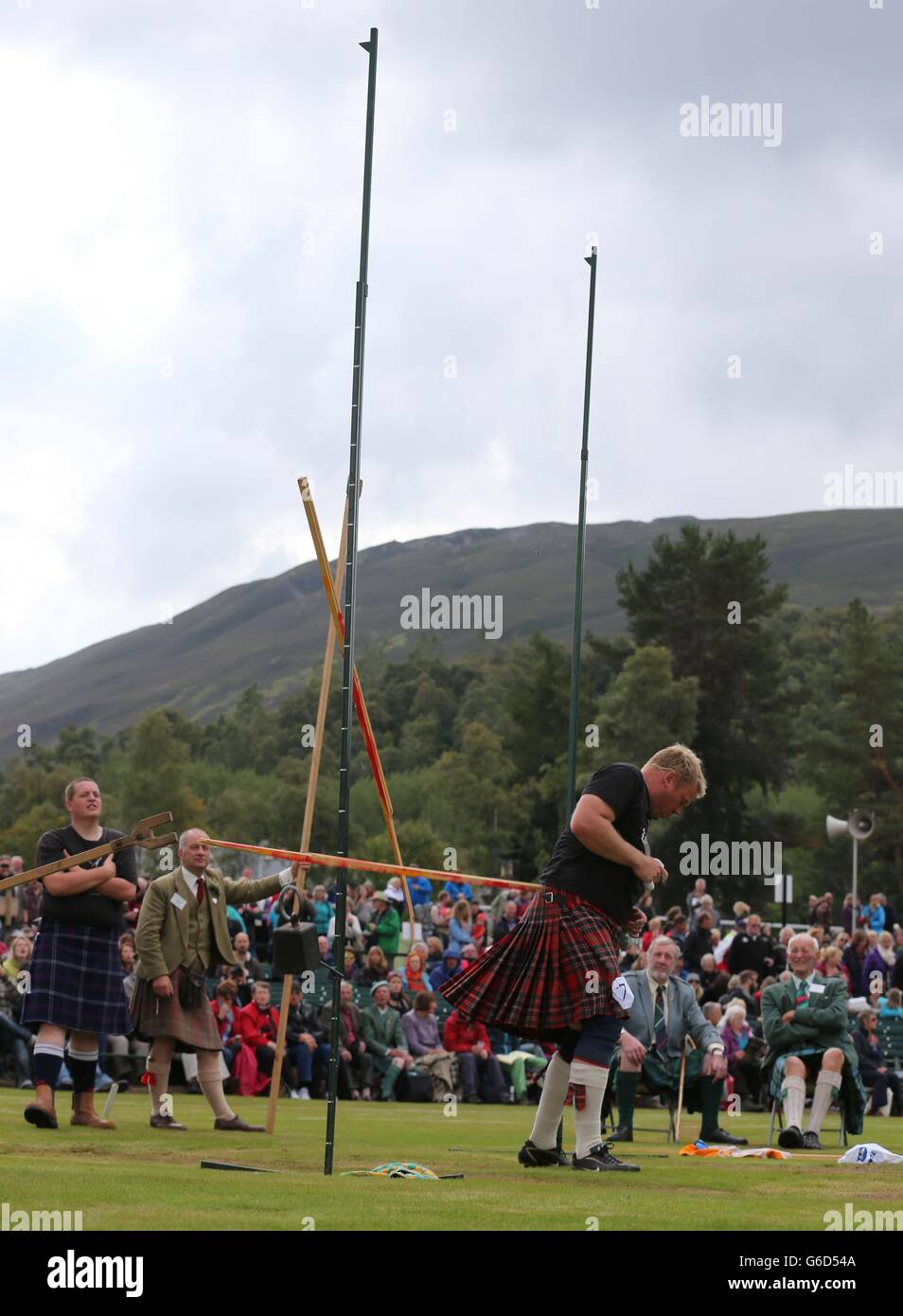 Heavy weight Bruce Robb tosses the hammer over the bar but it lands on ...