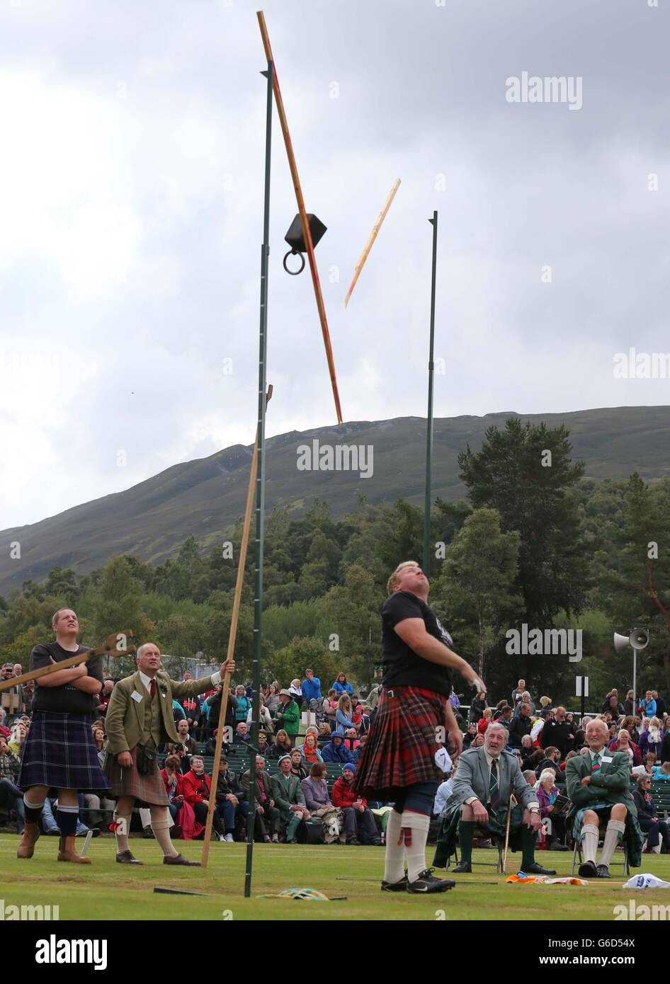 Heavy weight Bruce Robb tosses the hammer over the bar but it lands on ...