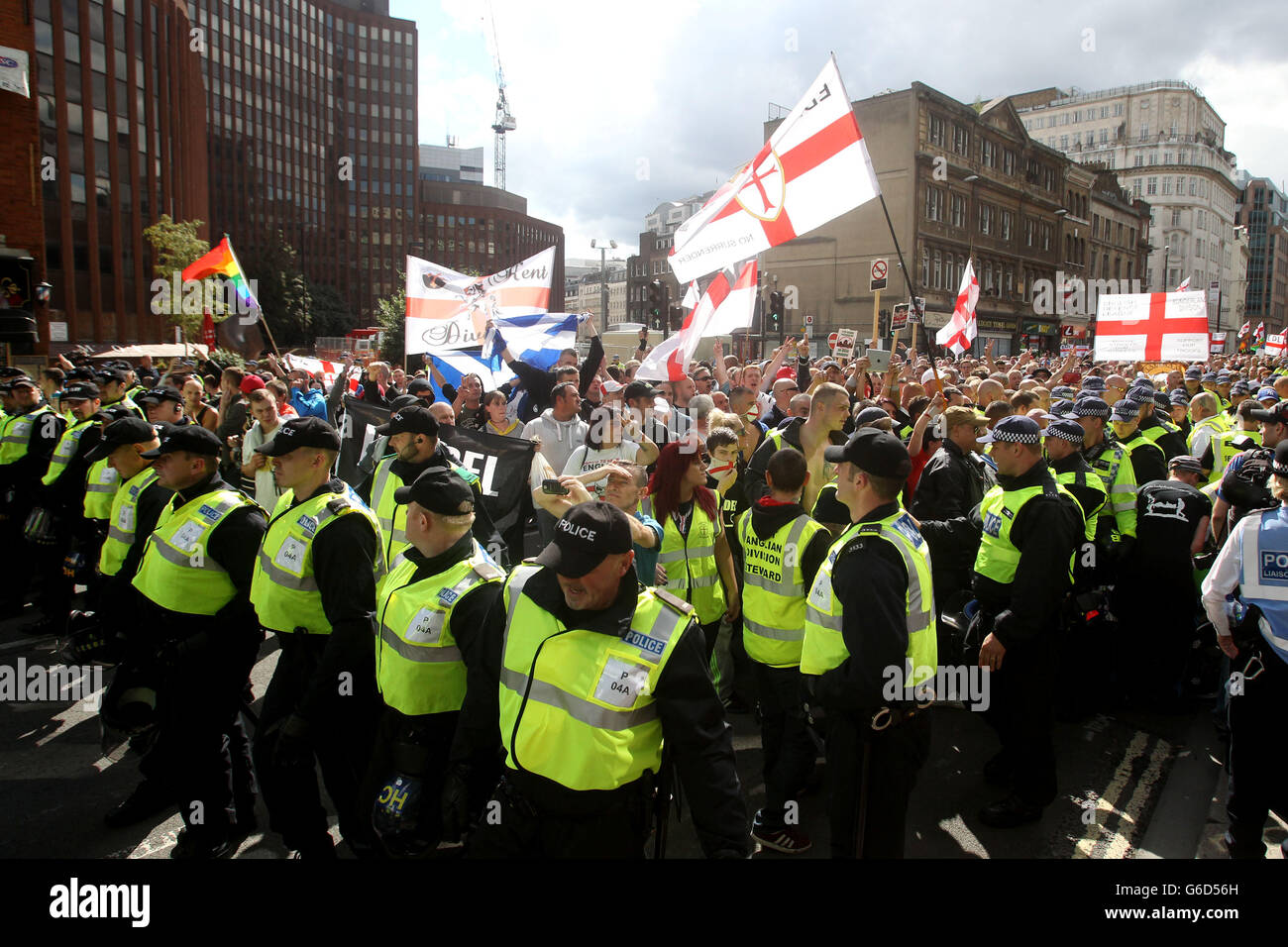 Police hold back the English Defence League (EDL) march near Tower ...