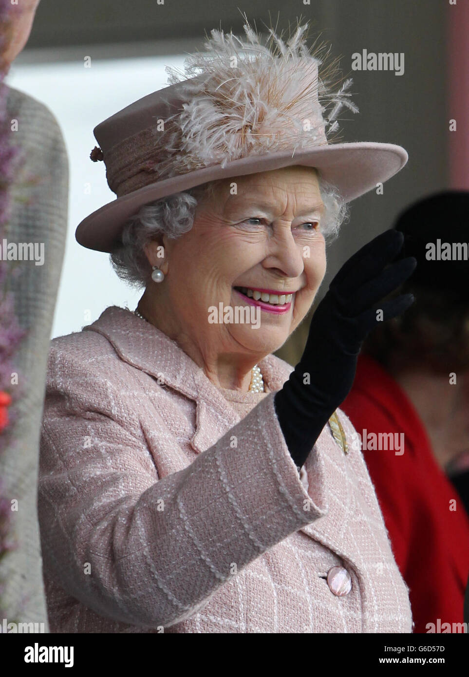 Queen Elizabeth II waves as she arrives at the Braemar Gathering in ...