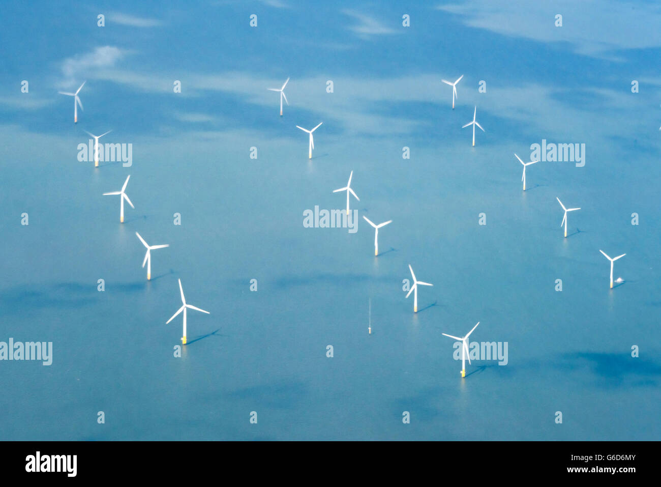 Horizontal aerial view of a wind farm on the north coast of Kent, Great ...