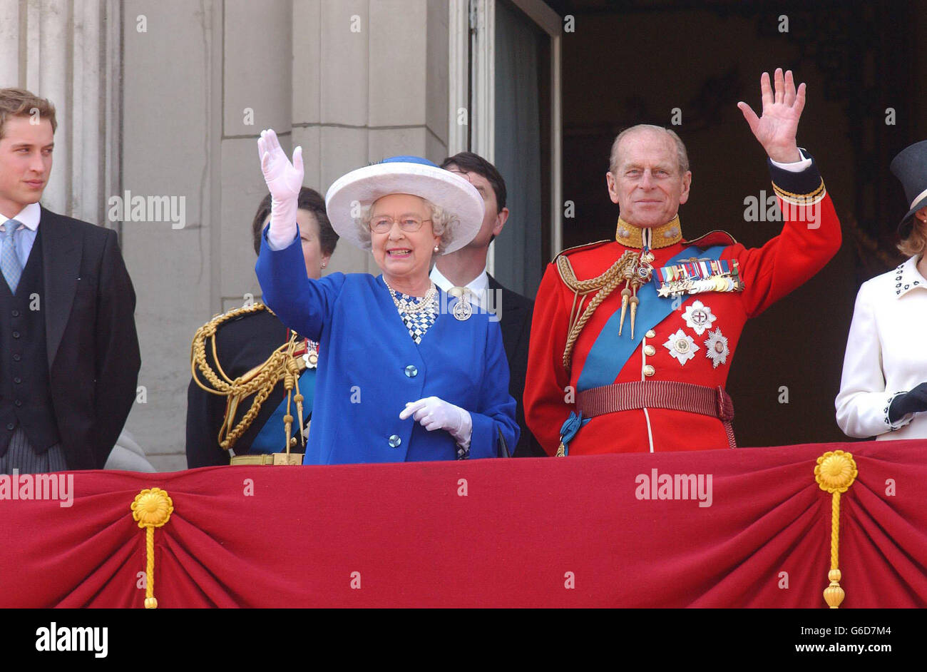Queen Elizabeth II and the Duke of Edinburgh wave from the balcony as ...