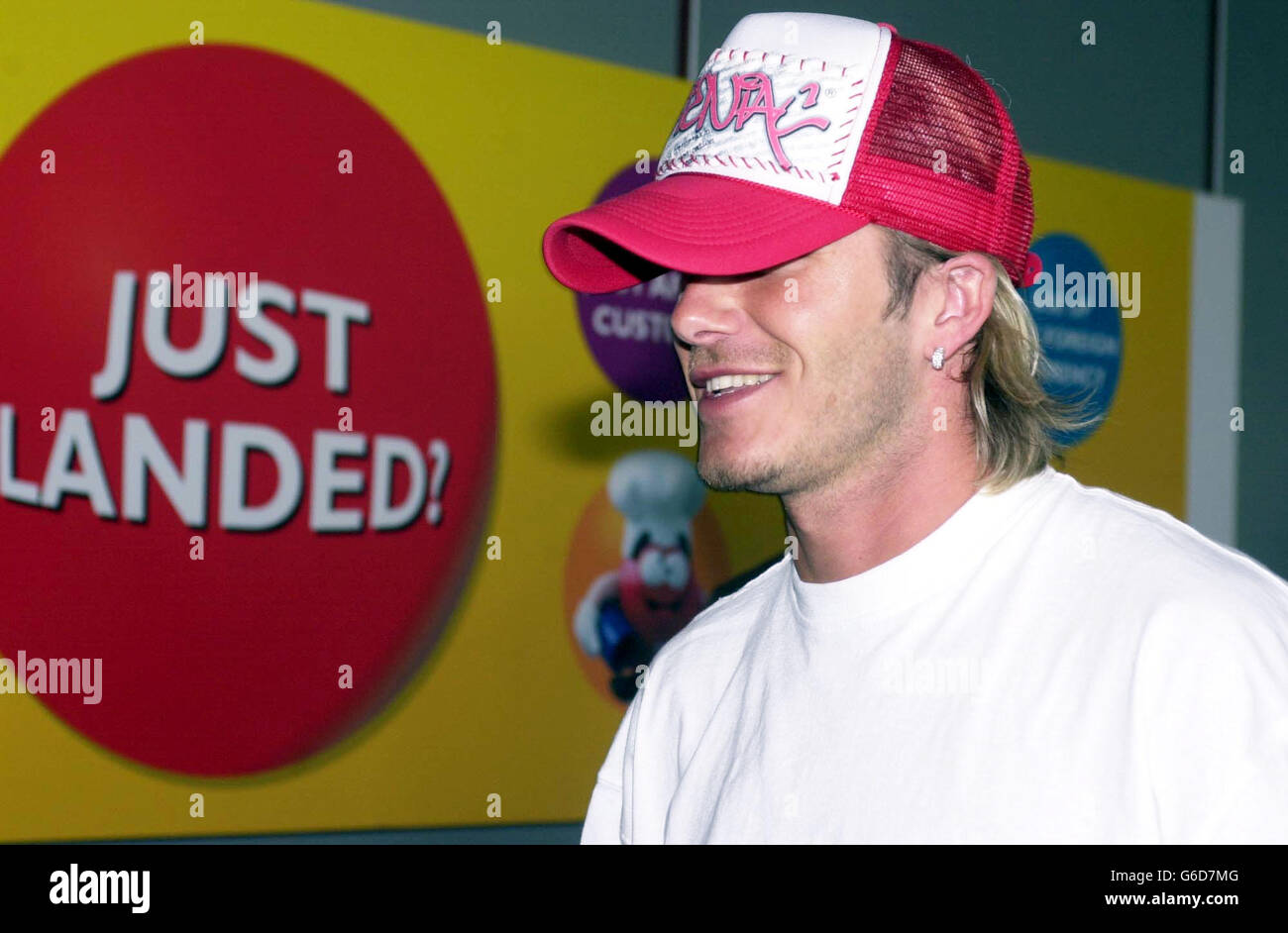 Footballer David Beckham arrives with his family at Heathrow Airport ...
