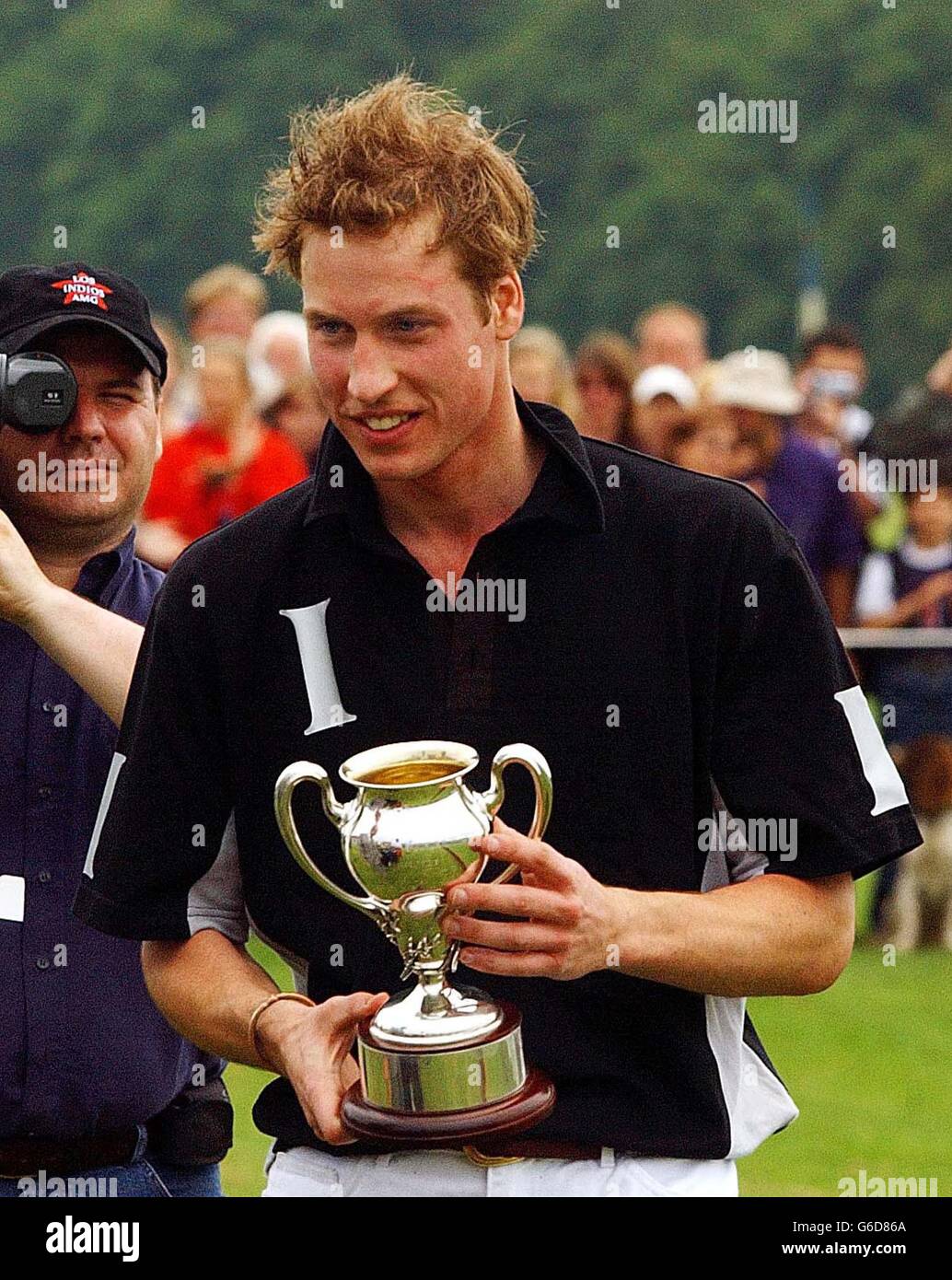 Prince William collects the trophy after his team Mercedes AMG won the ...